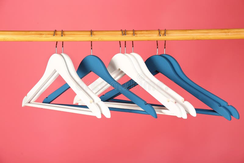 Empty Clothes Hangers on Wooden Rail Stock Photo - Image of modern ...