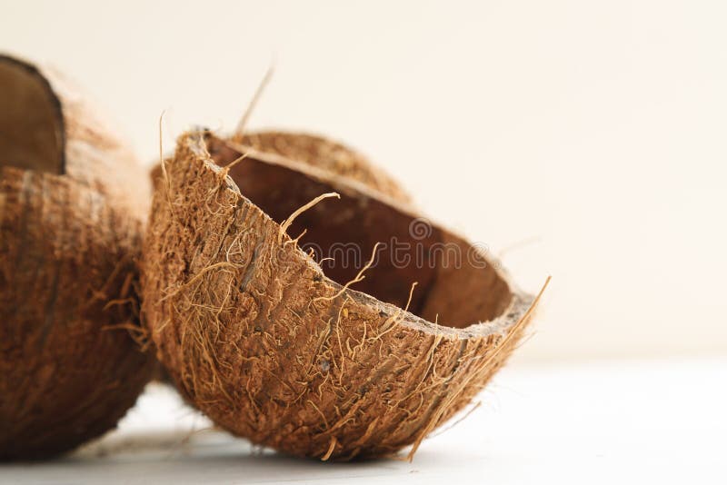 Empty Coconut Shells on a White Wooden Table, Macro Stock Photo - Image ...