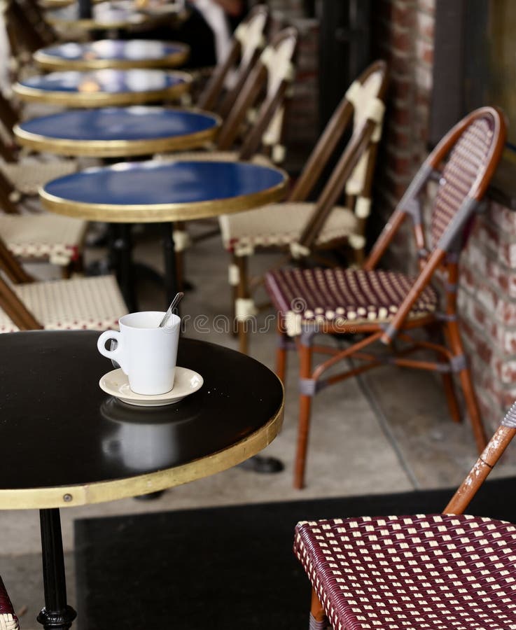 An Empty Coffee Cup at Sidewalk Cafe Stock Photo - Image of bamboo ...