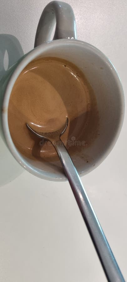 Empty Coffee Cup with Spoon on Table. Vertical Image. Stock Image ...