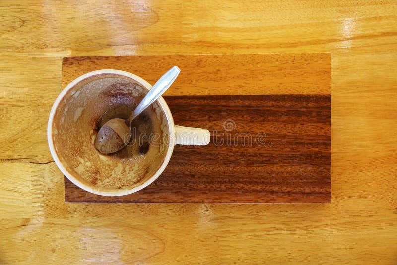 Empty Coffee Cup with Spoon on Wood Plate and Table Stock Image - Image ...