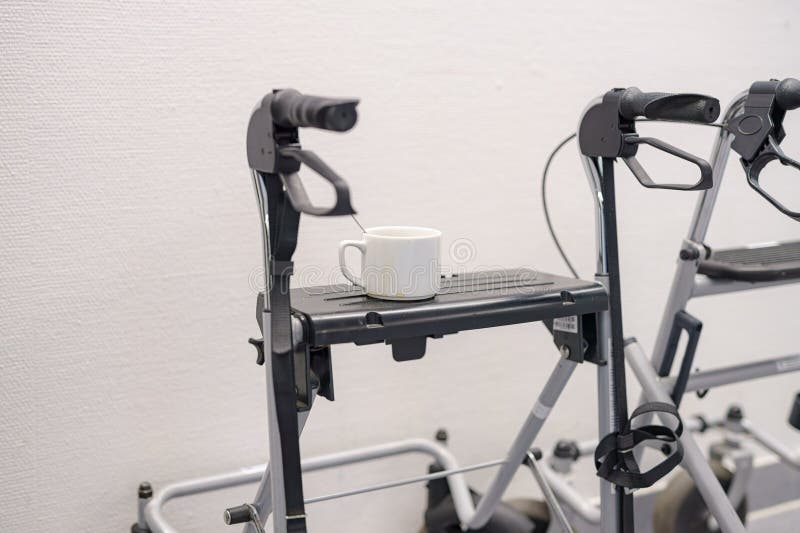 An Empty Coffee Cup Stands on a Walker for the Elderly and Disabled in ...