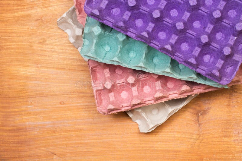 Empty Colored Cardboard Egg Tray on a Wooden Table Stock Photo - Image ...