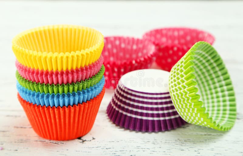 Empty Colorful Cupcake Cases on the White Wooden Background Stock Image ...