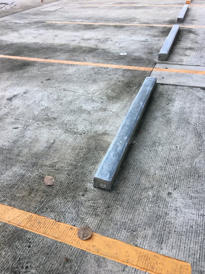 Empty Concrete Parking Stalls Stock Image - Image of yellow, lines ...