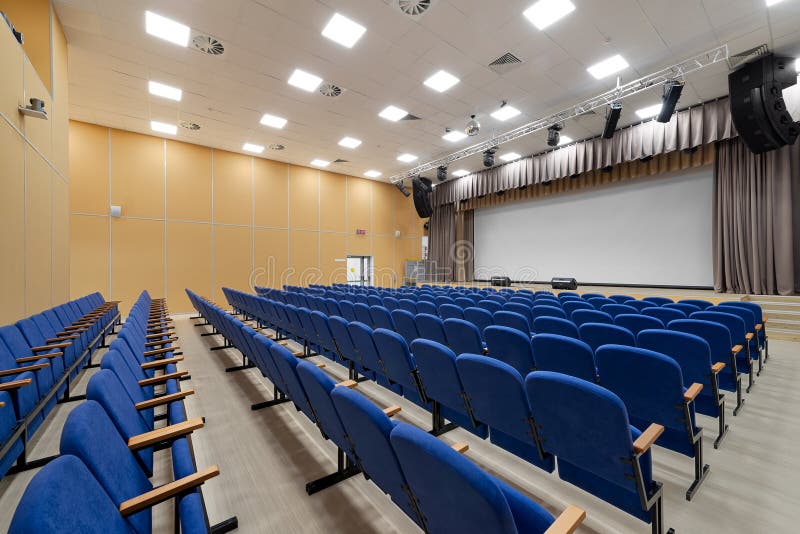 Empty Conference Room Interior with a Stage and Blue Chairs Stock Photo ...
