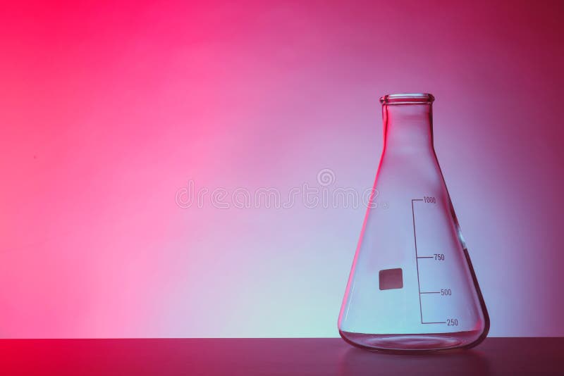 Empty Conical Flask on Table Against Color Background. Stock Image ...