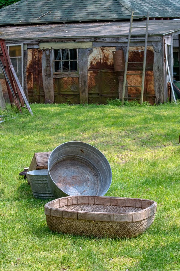 Empty Containers in a Old Farm Yard Stock Photo - Image of circle ...