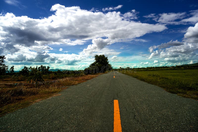 An Empty Country Road with the Landscape of the Sky and Clouds Stock ...