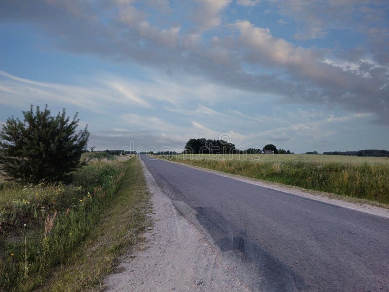 Empty Country Road. the Sun is Setting Stock Photo - Image of back ...
