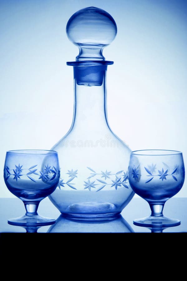 Empty Crystal Alcohol Decanter and Two Glasses for Vodka Standing on a ...
