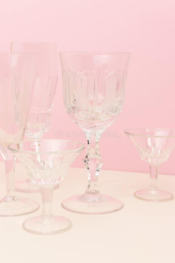 Empty Crystal Glasses in Front of Pink Background. Stock Image - Image ...