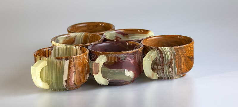 Empty Cups Made of Multi-colored Onyx in Yellow-orange Tones on a White ...