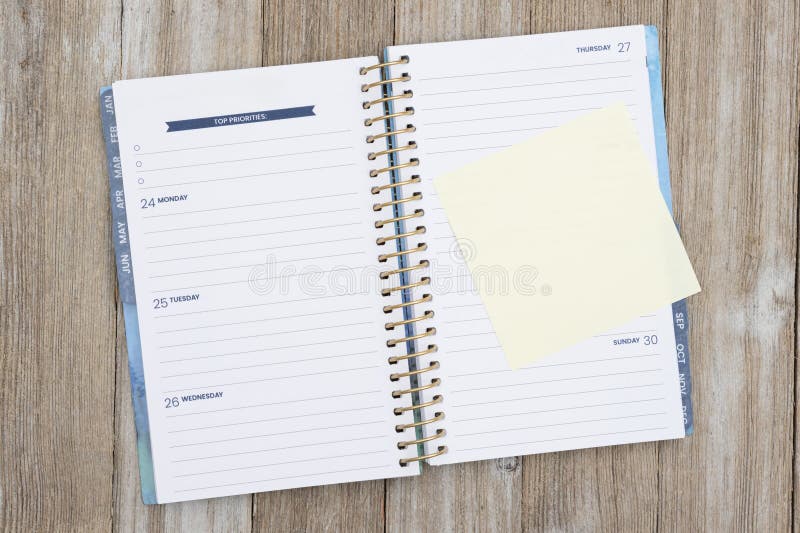 Empty Day Planner with Sticky Note on Wood Stock Image - Image of ...