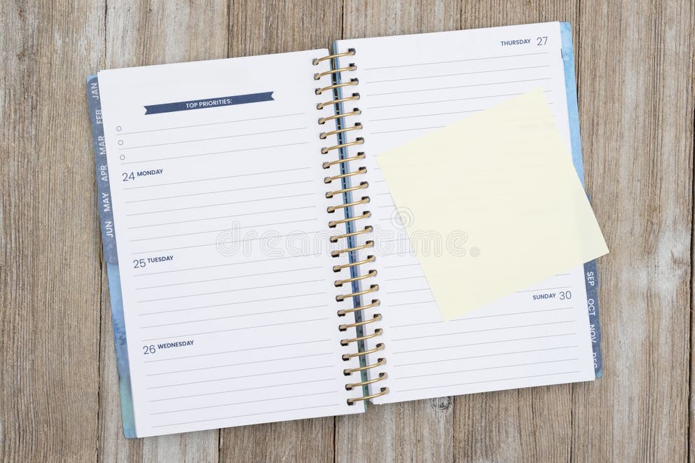 Empty Day Planner with Sticky Note on Wood Stock Image - Image of ...