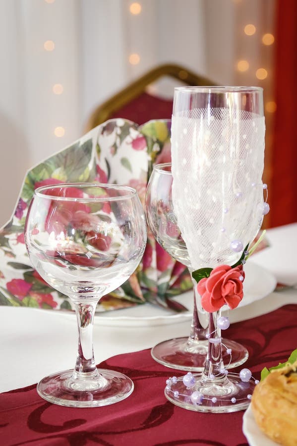 Empty Decorative Glass Champagne Glasses Stand on the Table. Festive ... Empty Decorative Glass Champagne Glasses Stand on the Table. Festive ...