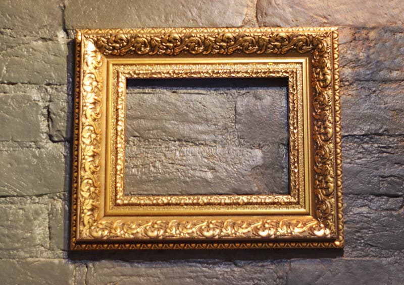 Decorative Gold Colored Picture Frame on a Brickstone Wall Stock Image ...