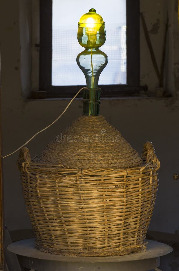 Empty Demijohn with a Light Bulb Turned on Stock Photo - Image of ...