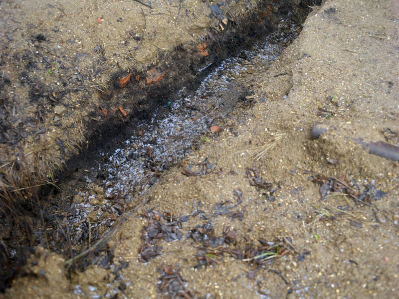 Trench digged on a land stock image. Image of digging - 97696657