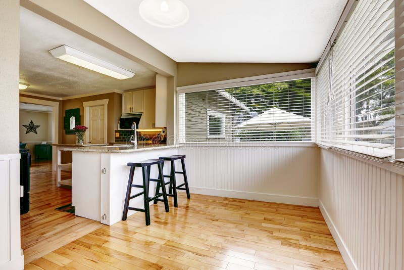 Empty Dining Area with White Plank Trim Stock Photo - Image of ...