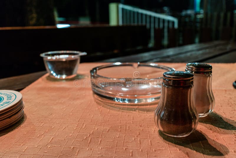 Empty Dinner Table with Ash Tray Stock Image - Image of orange, glass ...