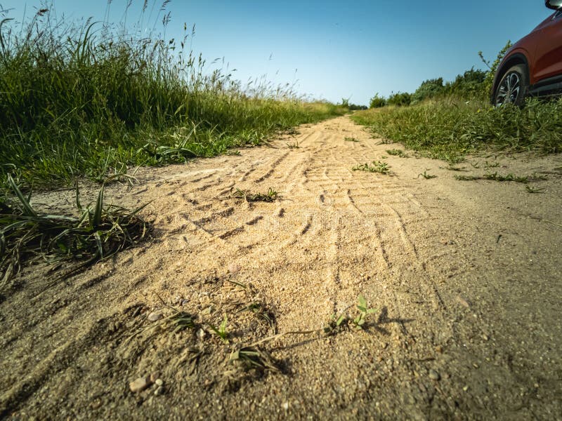 Empty Dirt Road through the Meadow. Footprints in the Sand. Horizontal ...