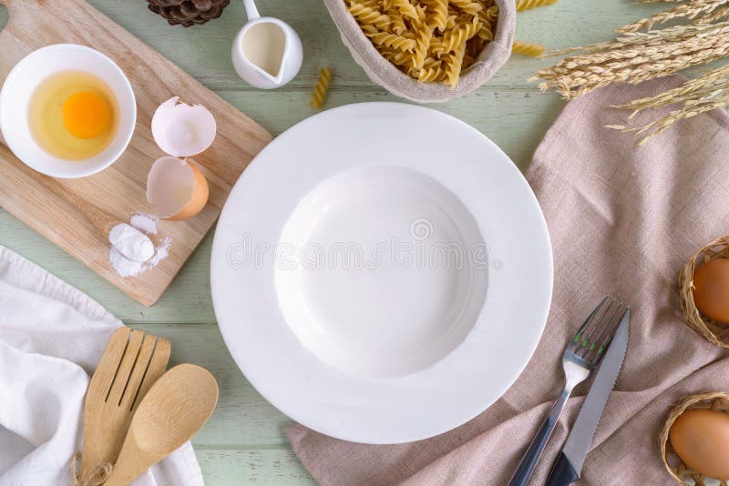 Empty Dish with Ingredients and Equipment on Green Wooden Table Stock ...
