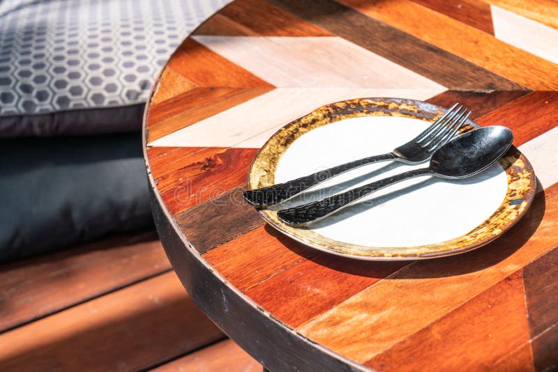 Empty Dish with Spoon and Fork on Table Stock Image - Image of meal ...