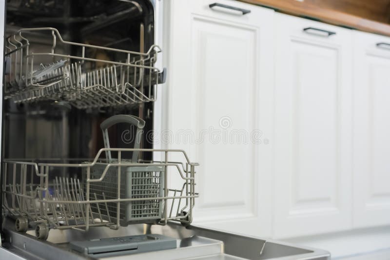 An Empty Dishwasher with Two Compartments in Gray Tones Stands with an ...