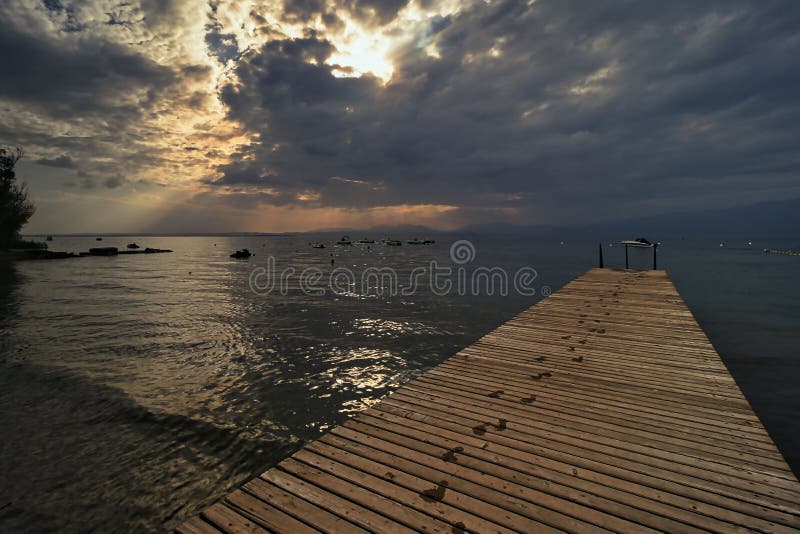 Empty Dock Against the Background of the Sea and Cloudy Sky at Sunset ...