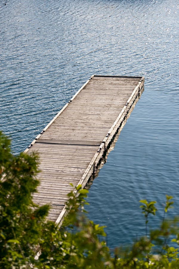 An Empty Dock Extending into the Water Stock Photo - Image of green ...