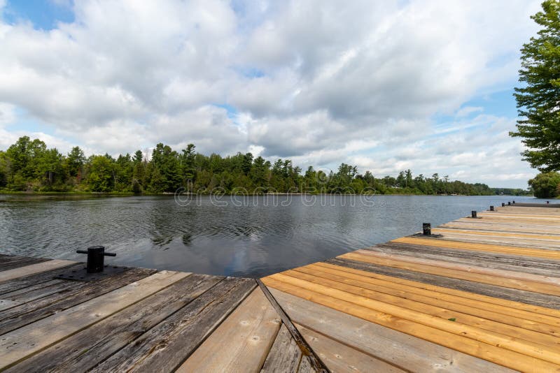 Empty dock beside a river stock photo. Image of river - 259680188