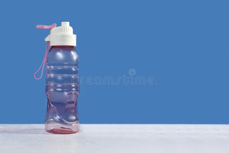 The Empty Drinking Water Bottle Pink on a Bright Blue Background Stock ...