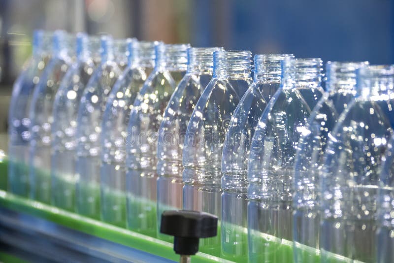 The Empty Drinking Water Bottles on the Conveyor Belt for Filling ...