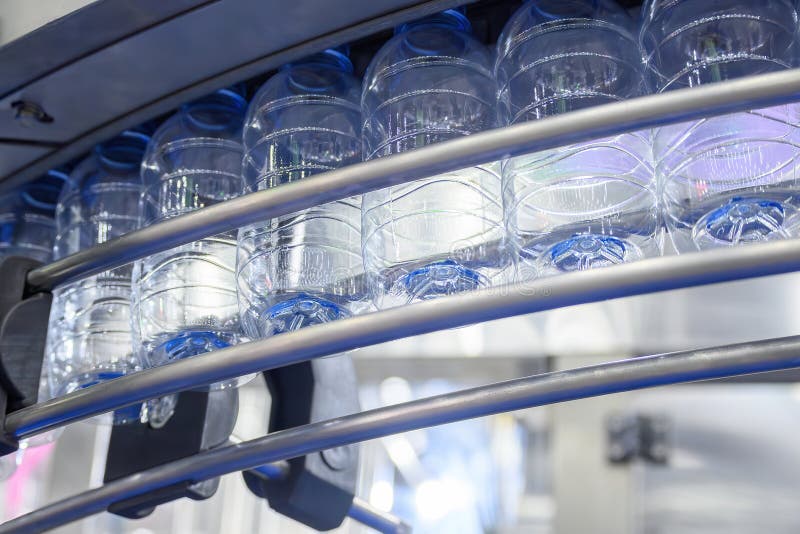 The Empty Drinking Water Bottles Hanging on the Conveyor Belt for Filling Process Stock Image ...