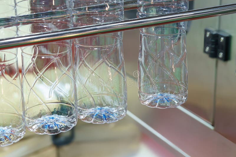 Empty Drinking Water Bottles Hanging Overhead Conveyor Belt Filling ...