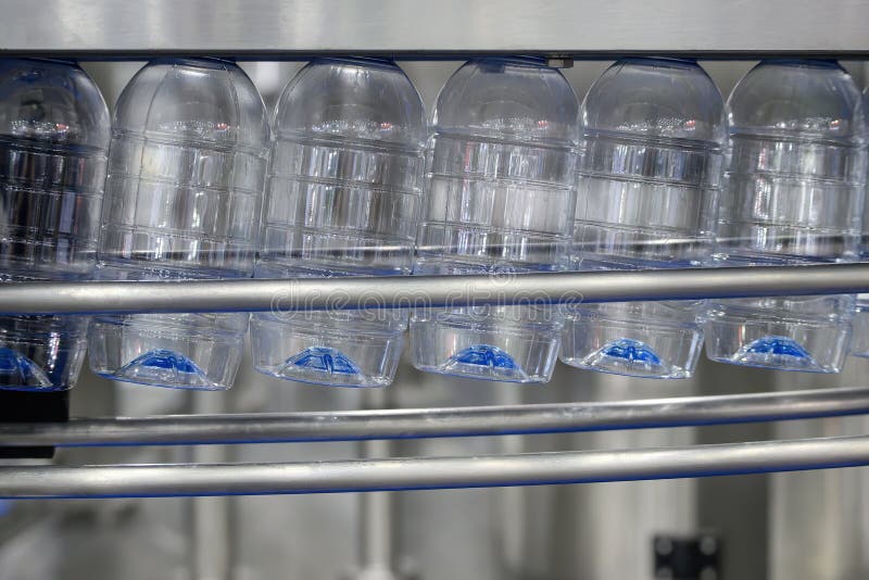 Empty Drinking Water Bottles Hanging Overhead Conveyor Belt Filling ...