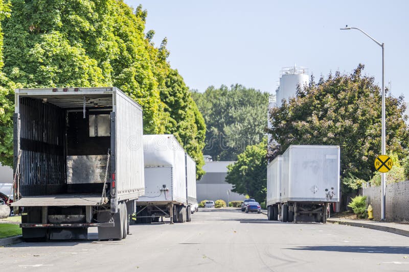 Empty Dry Van Semi Trailers with Open Back Door Standing on the Street ...