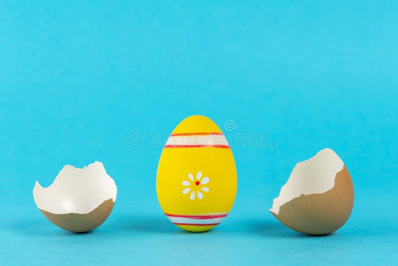 Empty Eggshell with Color Easter Egg on Pastel Blue Background. Minimal ...