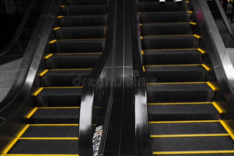 Empty Escalators Stairway with a Yellow Stripes. Stock Image - Image of ...