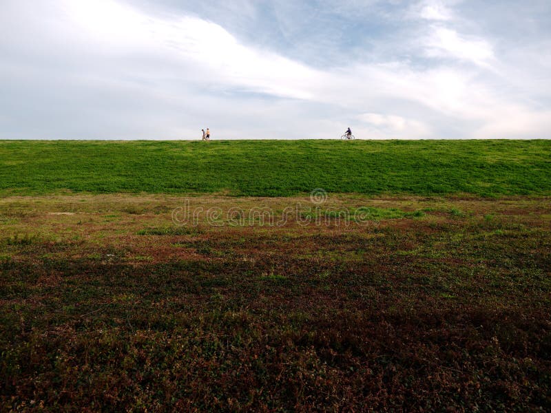 Empty Field and Sky with People on Horizon Stock Photo - Image of away ...