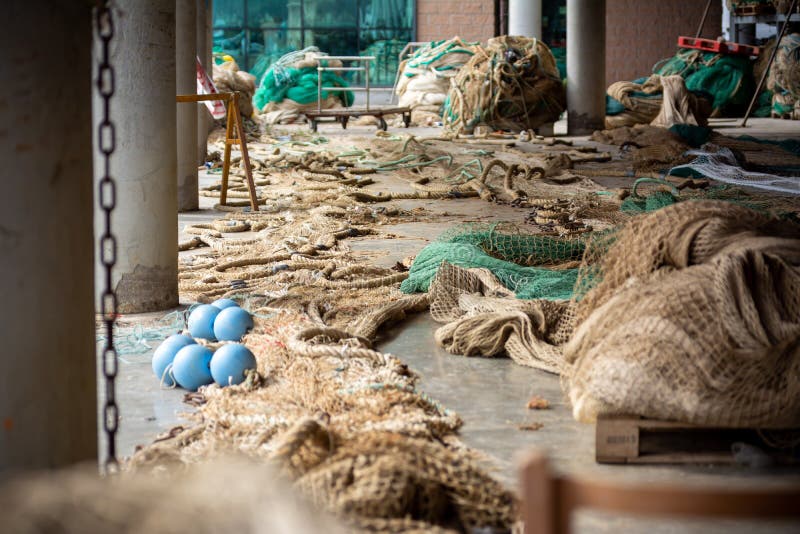 Empty Fish Nets Spread Out on the Ground at the Harbour Stock Image ...