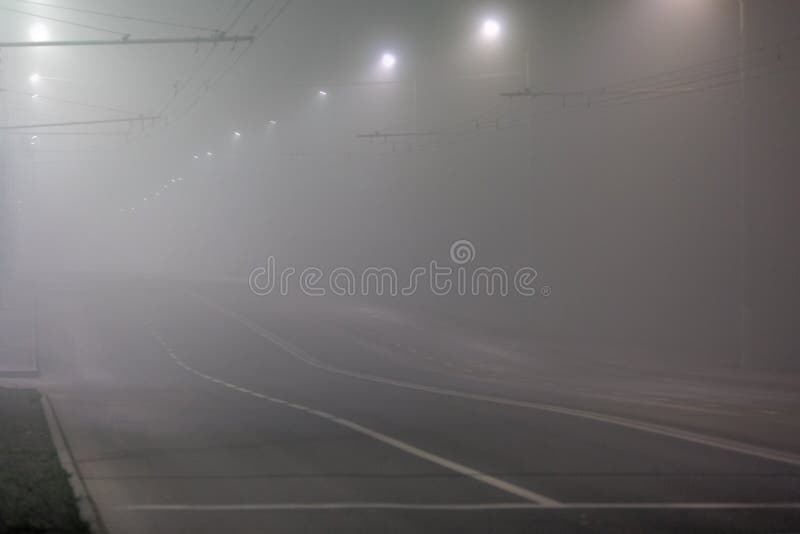 Empty Foggy Night Road with Rows of Lamp Posts Stock Photo - Image of ...