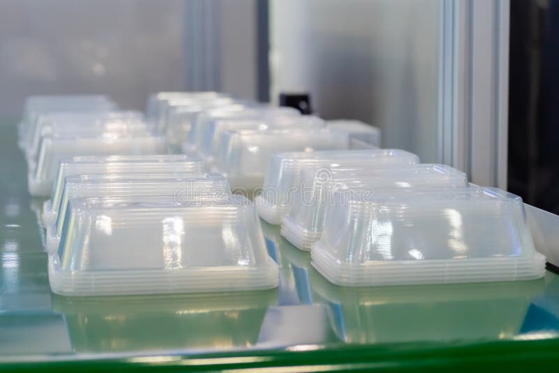 Empty Food Containers on Conveyor Belt of Plastic Injection Molding ...