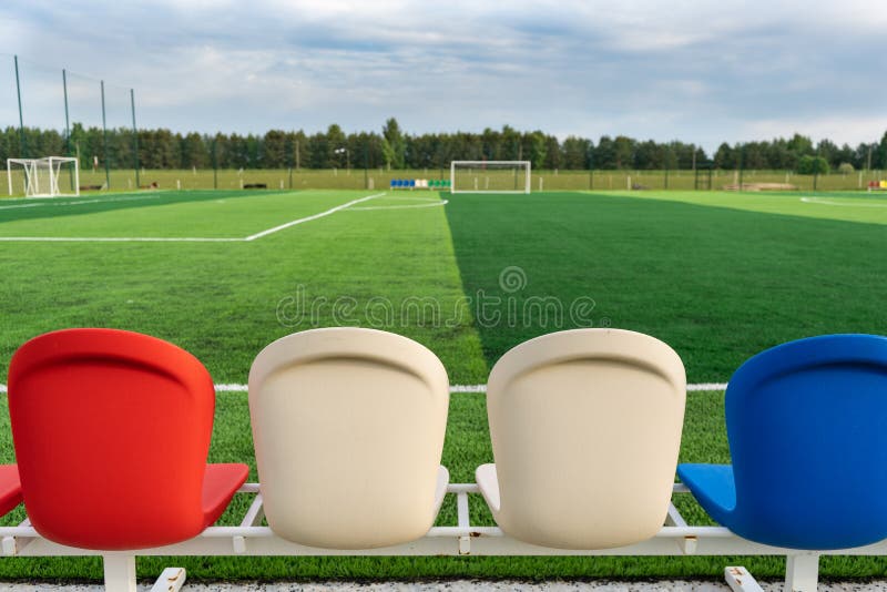 An Empty Football Field, Benches for the Reserves in the Foreground ...