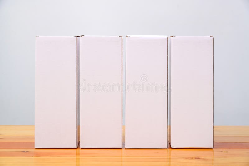 Empty Four Package White Cardboard Box for Long Items on Wooden Stock ...
