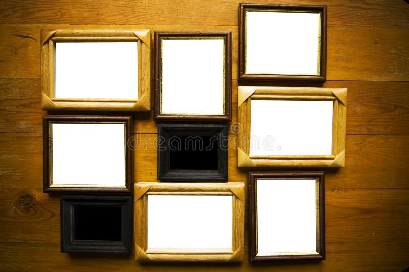 Empty Frames on Wooden Wall Stock Photo - Image of canvas, concept: 5262408