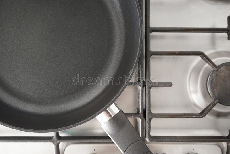 Empty Frying Pan on the Stove, Top View. Close-up Stock Photo - Image ...