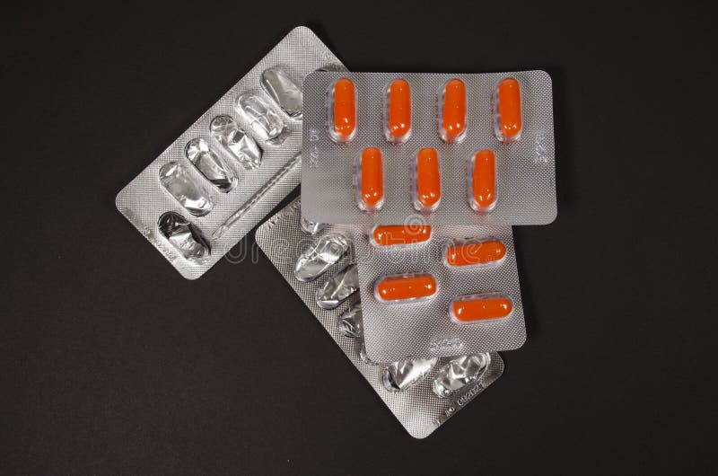 Empty and Full Silver Packages from Pills on a Dark Background Stock ...