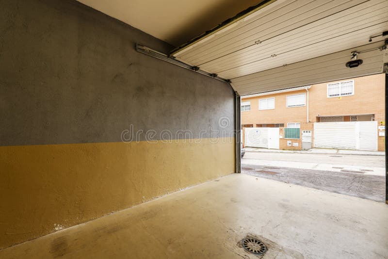 Empty Garage of a Detached House with Sliding Gate Stock Image - Image ...